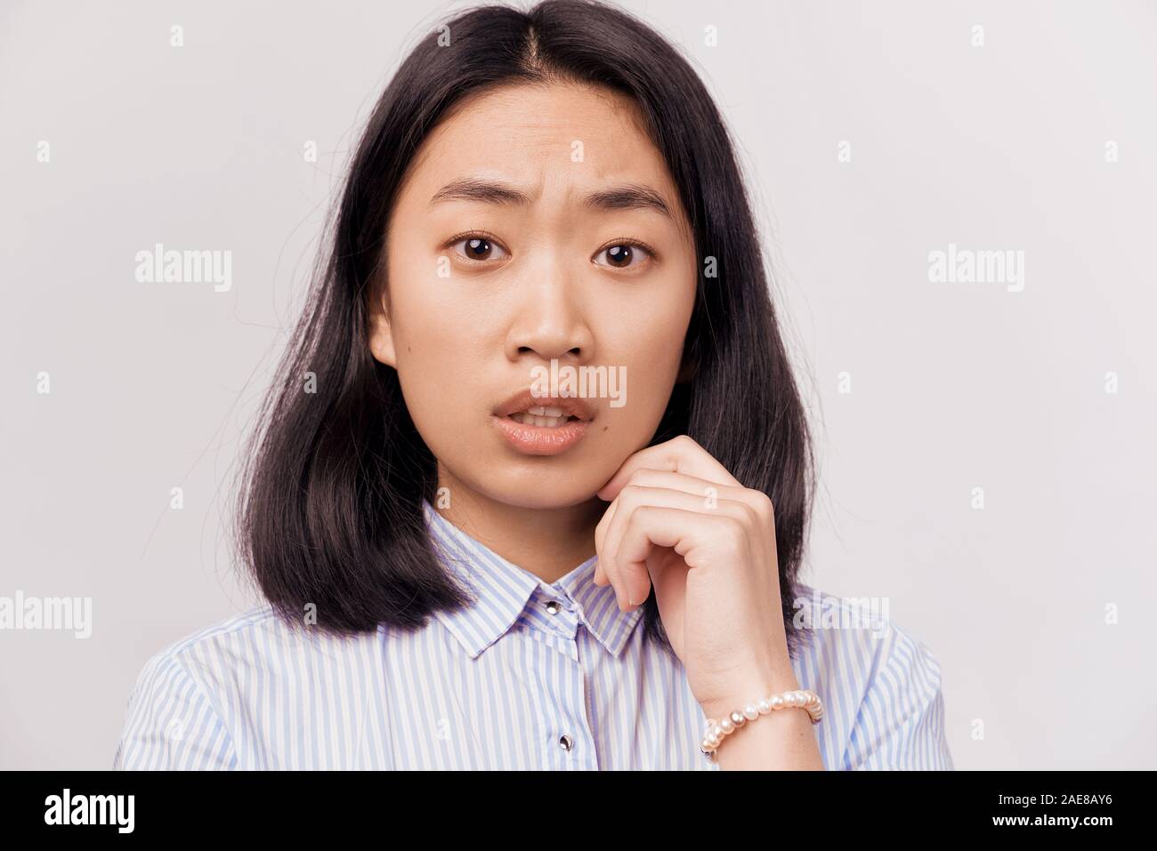 Sad concerned girl looking worried and thoughtful Stock Photo - Alamy