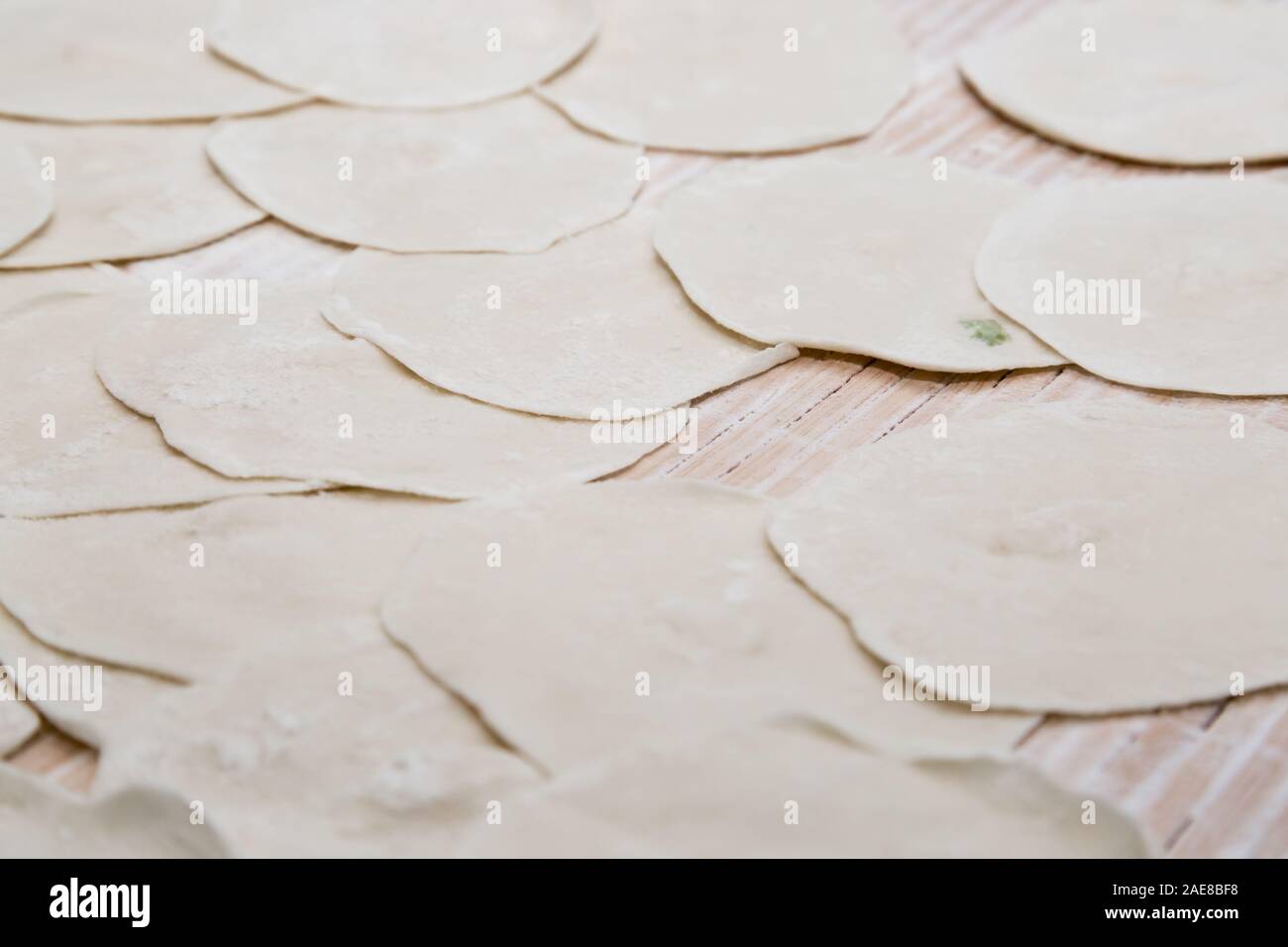 handmade Chinese traditional food dumpling wrapper on board Stock Photo ...