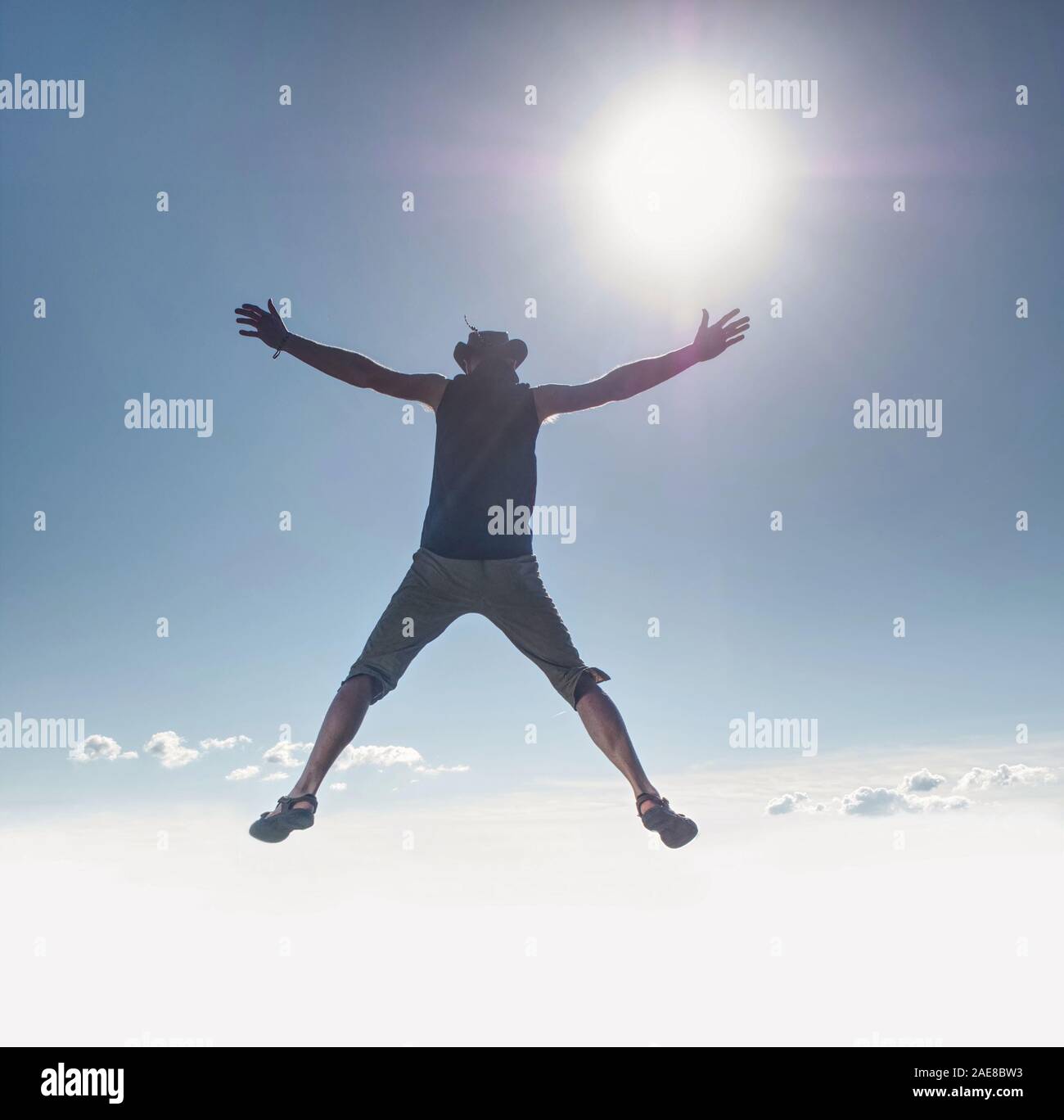 Brave cow man successful concept. Silhouette of man jumping over the ...