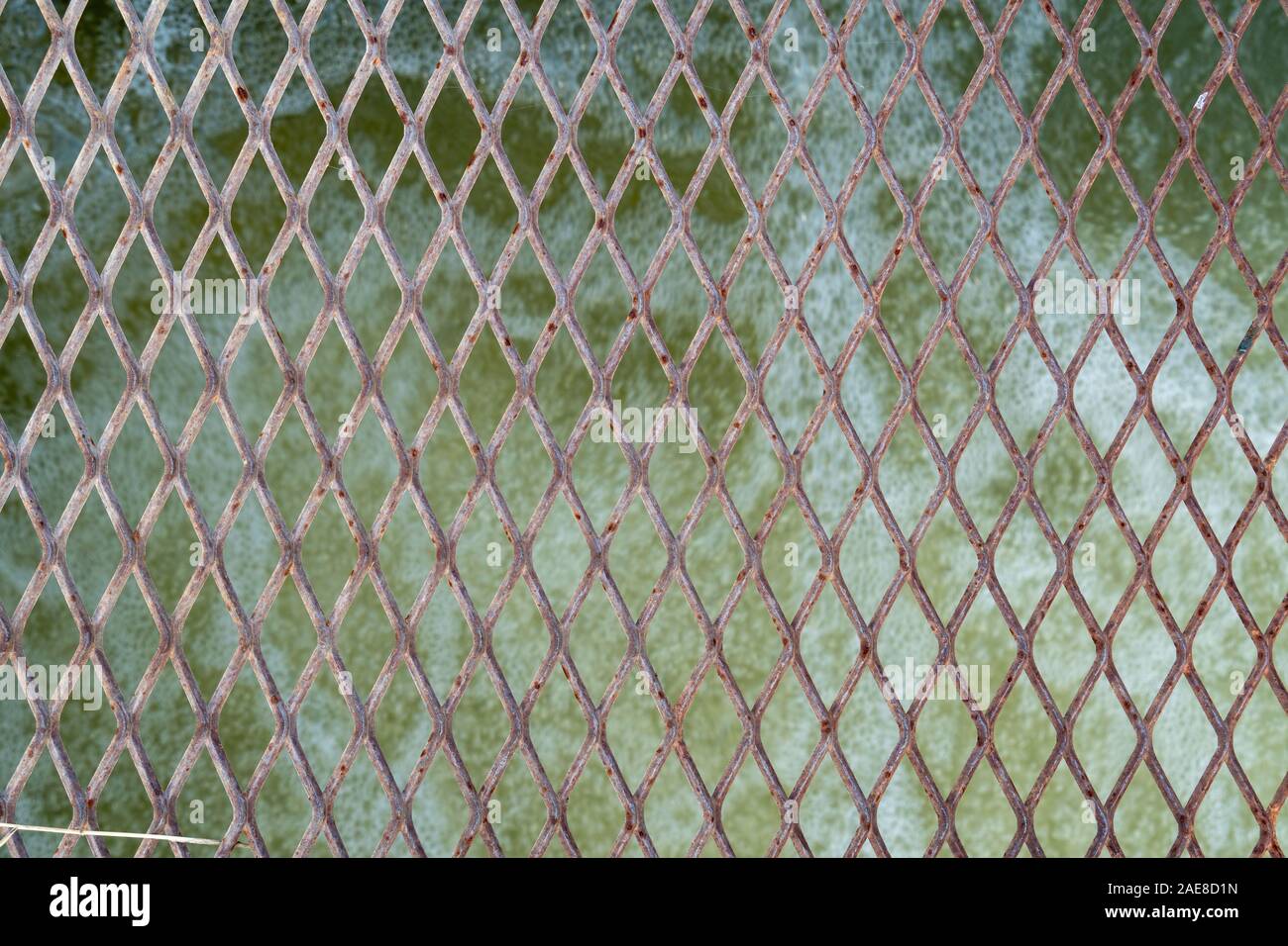 Rusted expanded steel grate metal over water Stock Photo - Alamy