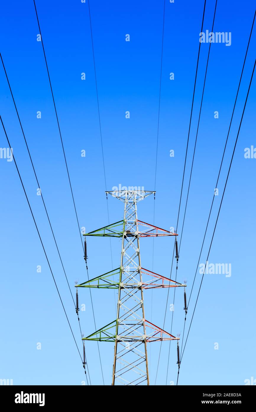 high tension cable metal tower in blue sky Stock Photo - Alamy