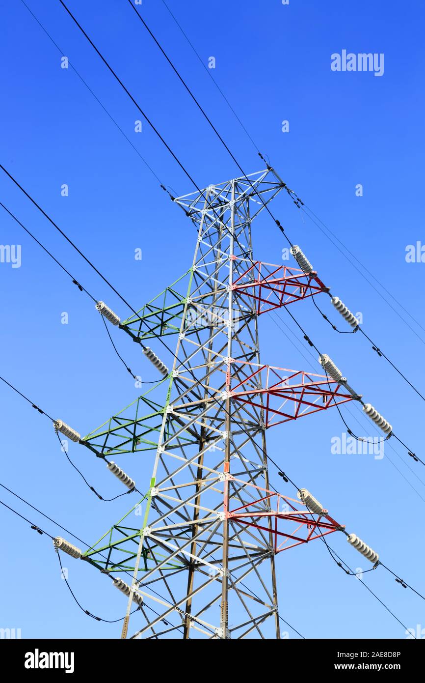 high tension cable metal tower in blue sky Stock Photo - Alamy
