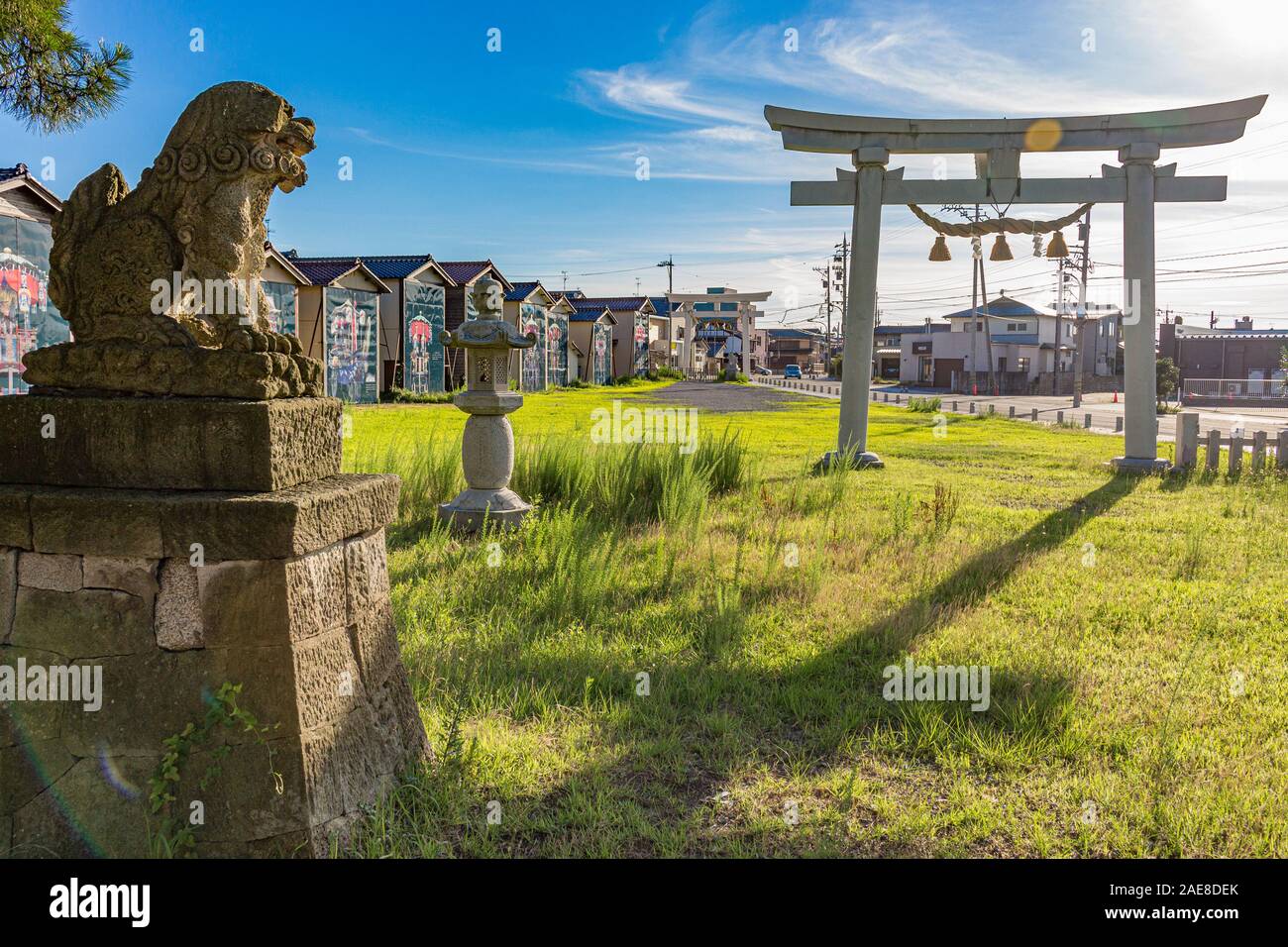At sundown, komainu and torii gate at the site of the annual Okaeri ...