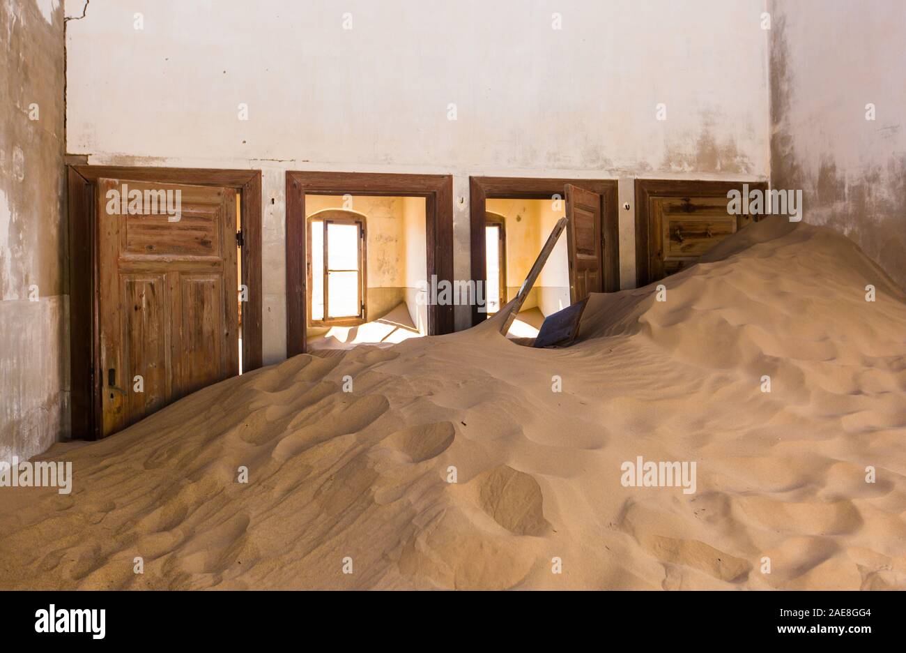 Abandoned and forgotten building and room being taken over by encroaching sandstorm, Kolmanskop ...