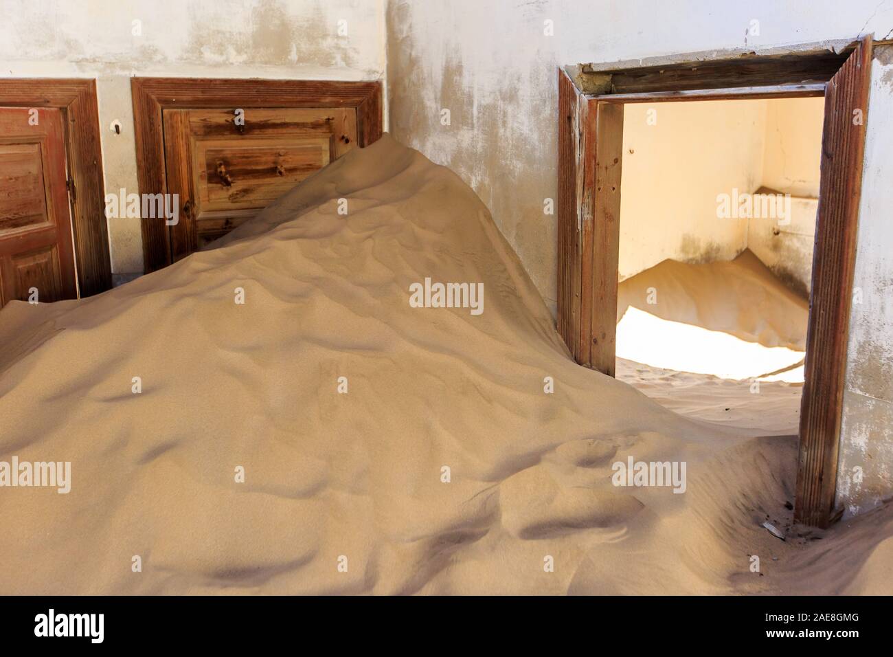 Abandoned and forgotten building and room being taken over by encroaching sandstorm, Kolmanskop ...