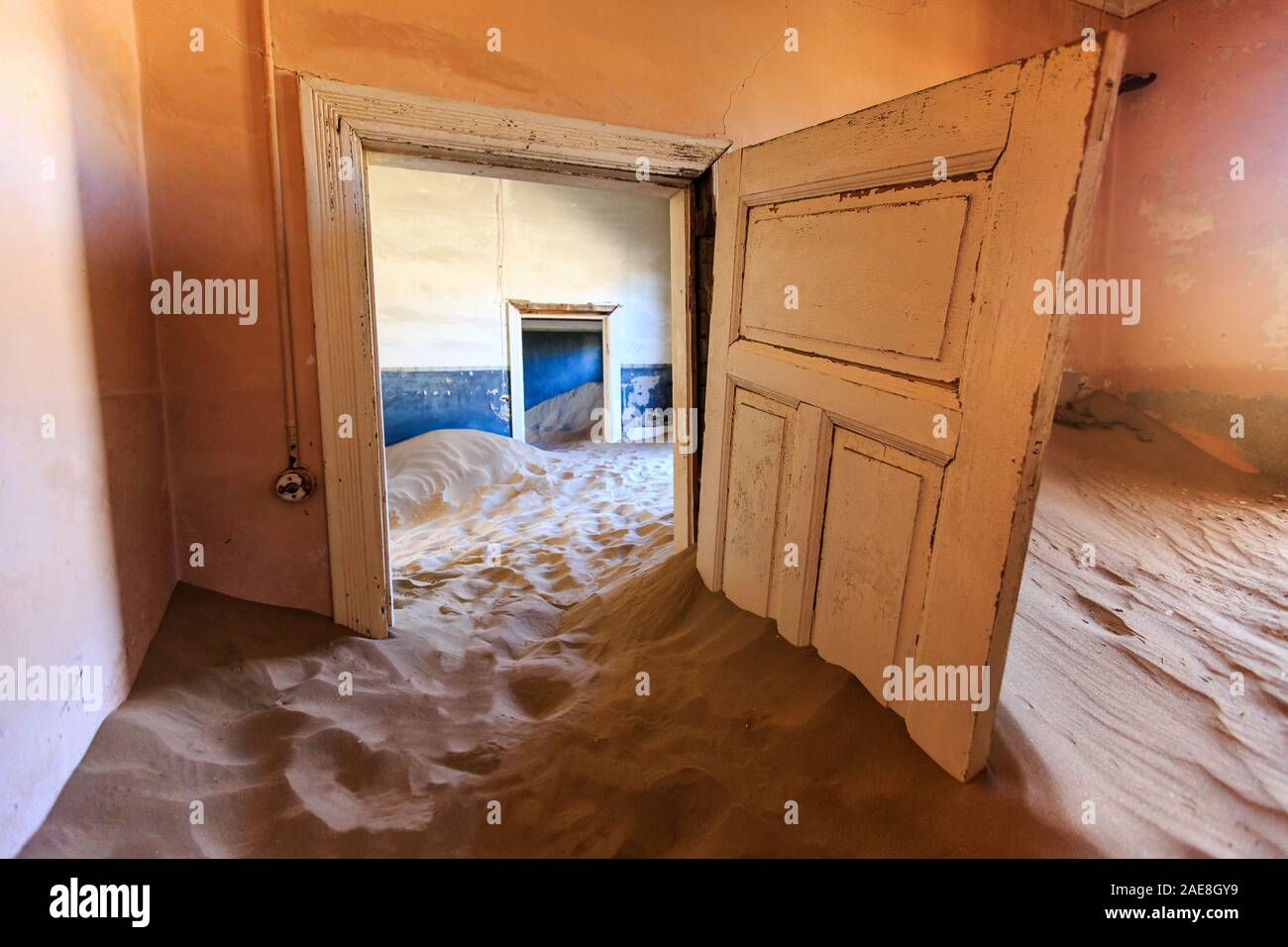 Abandoned and forgotten building and room being taken over by encroaching sandstorm, Kolmanskop ...