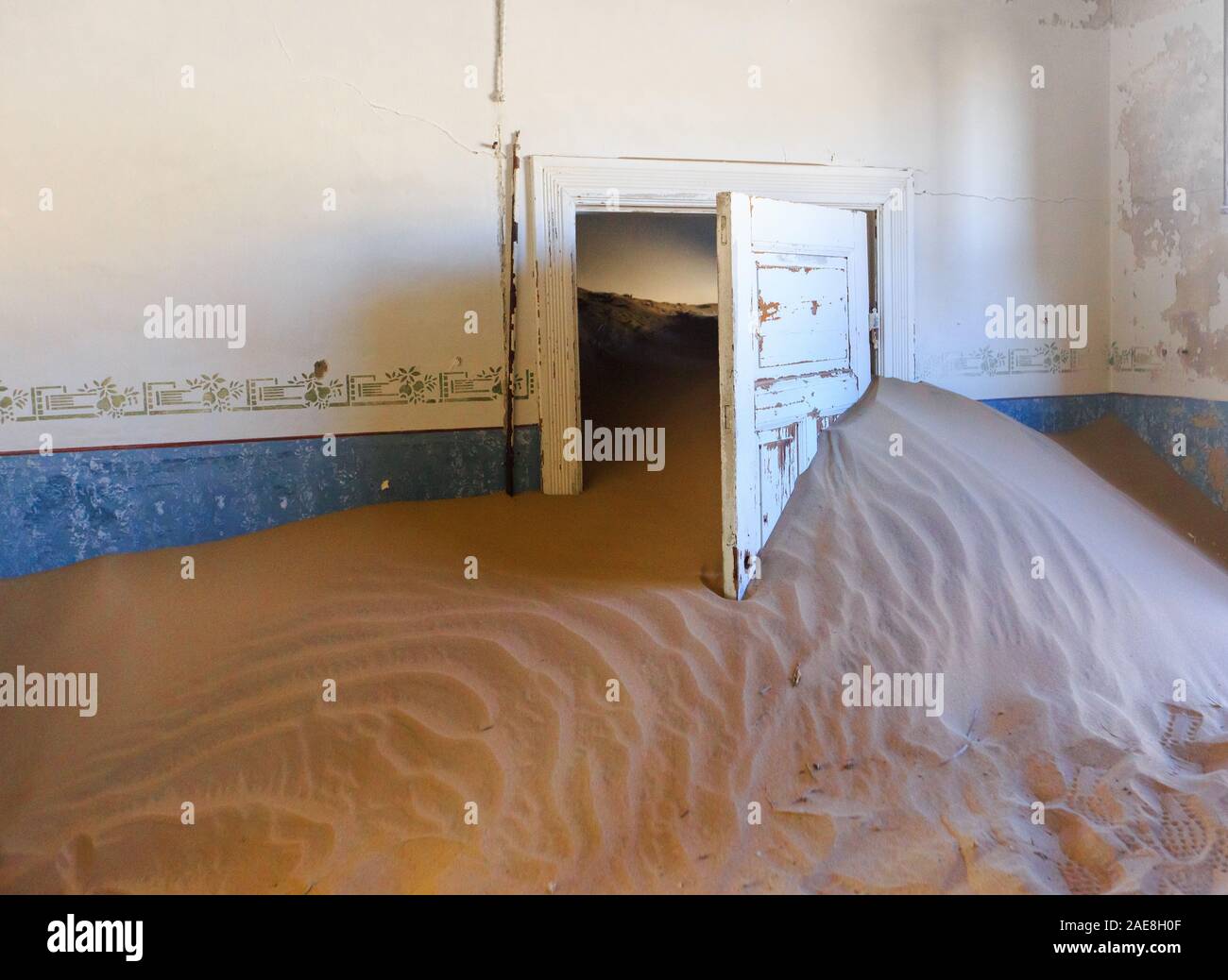 Abandoned and forgotten building and room being taken over by encroaching sandstorm, Kolmanskop ...