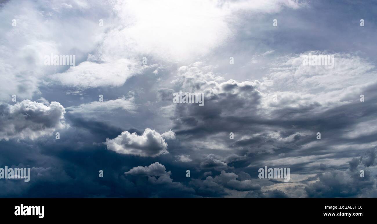 Beautiful bright sunset with flaring sun in the corner, blue skies and ...