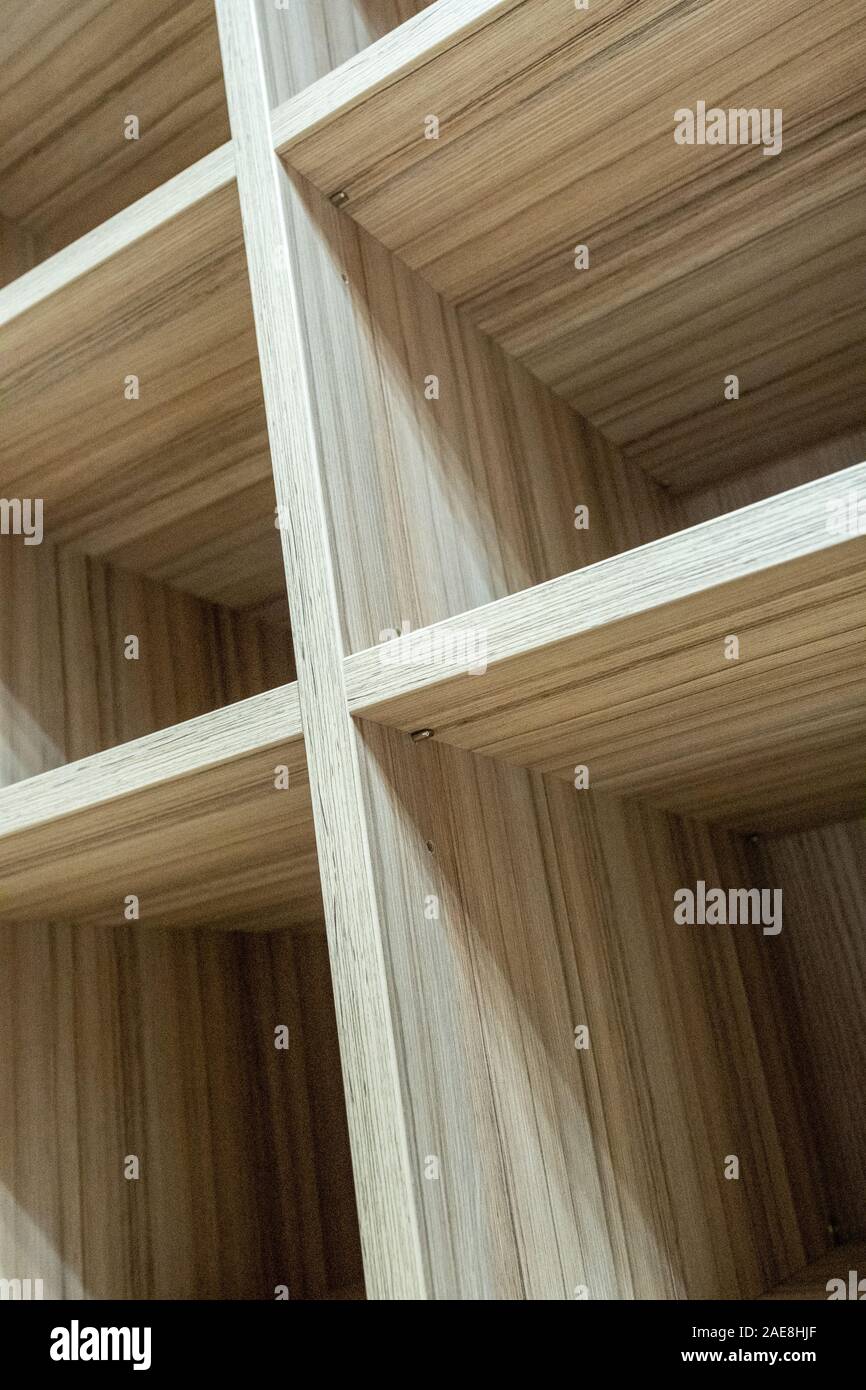 Fragment of a light wooden cabinet. empty cabinet shelves. Wooden shelf ...