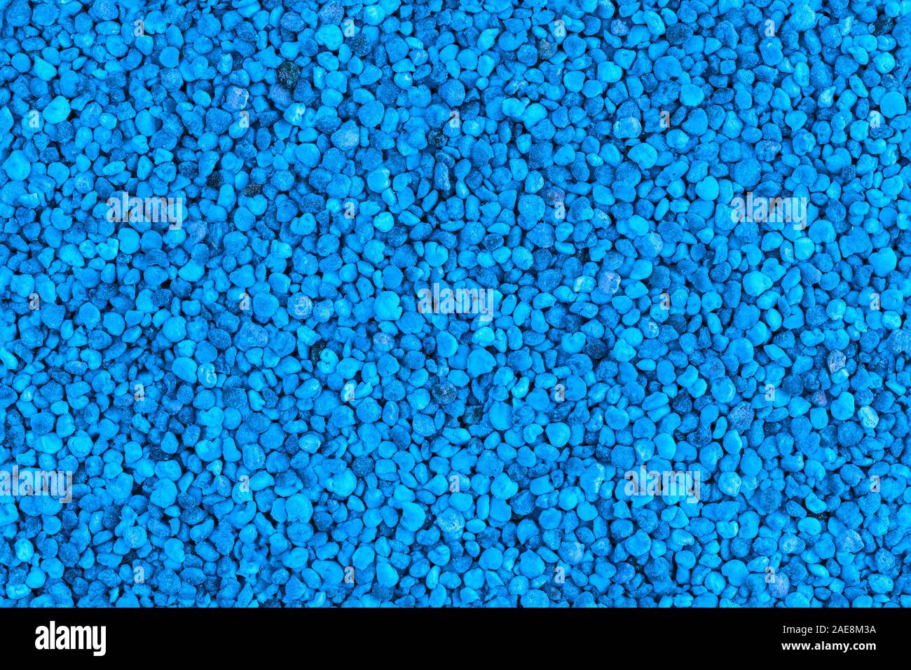 seamless flat texture and background of blue toned granules of bee ...