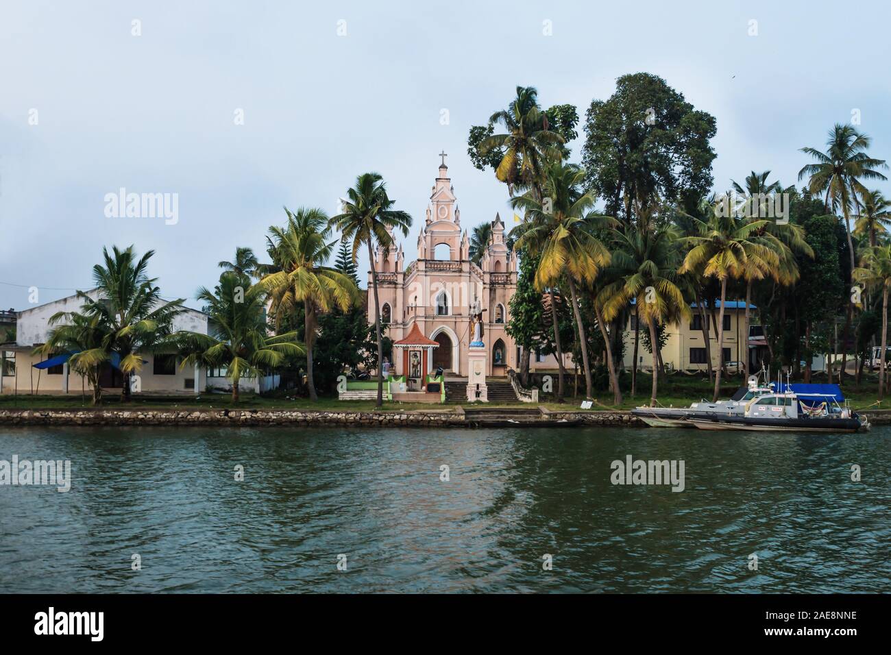 Church along the river of the kollam kottapuram waterway bewteen lush ...