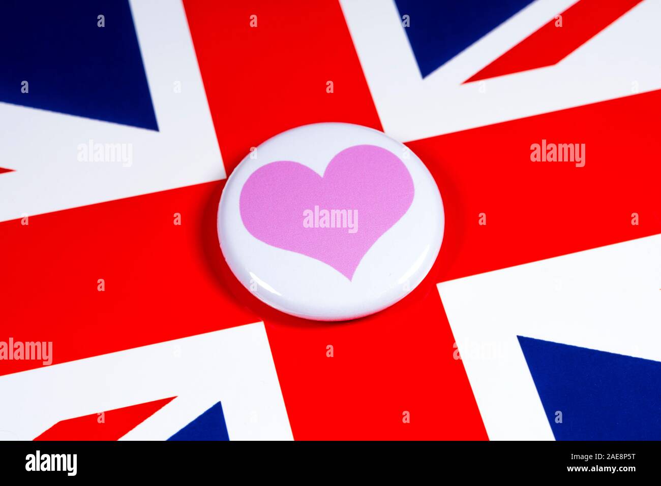 A pink heart symbol pictured over the flag of the United Kingdom Stock ...