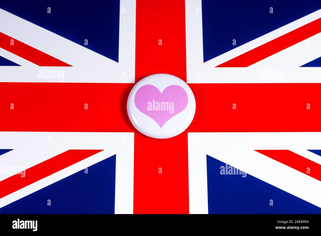 A pink heart symbol pictured over the flag of the United Kingdom Stock ...