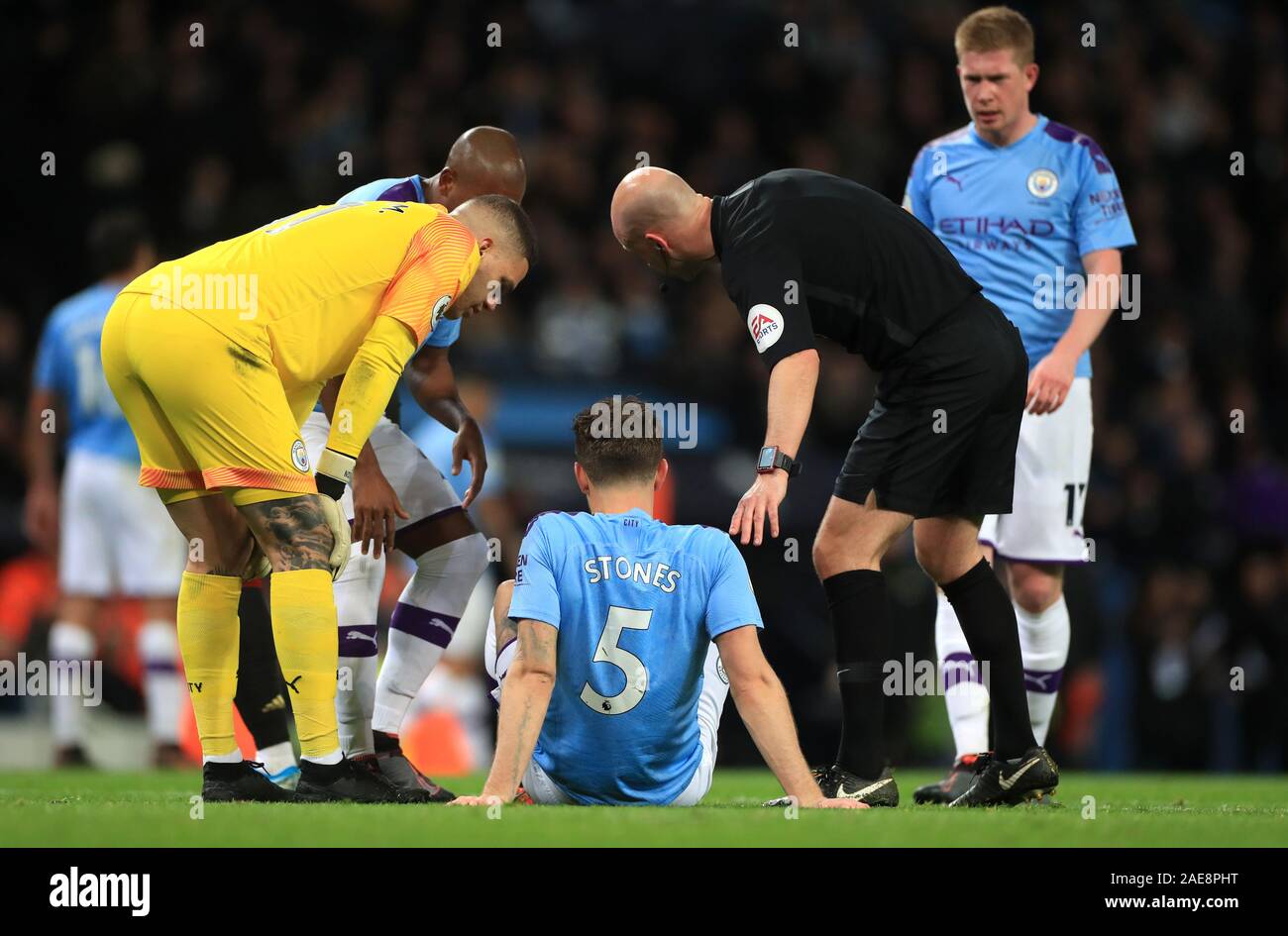 Manchester City's John Stones receives treatment for an injury during ...