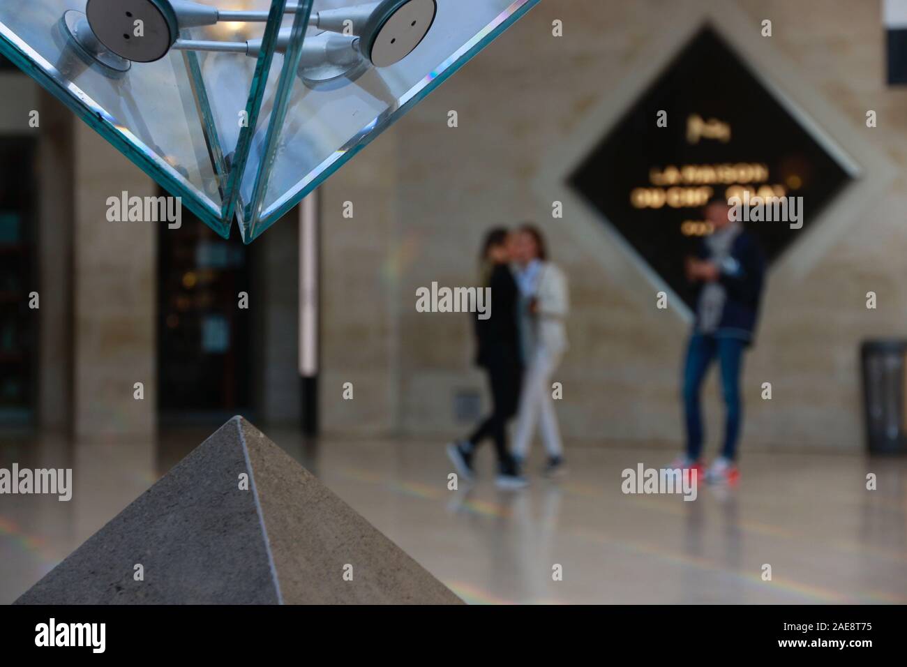 People and pyramid base in the Louvre underground Stock Photo - Alamy