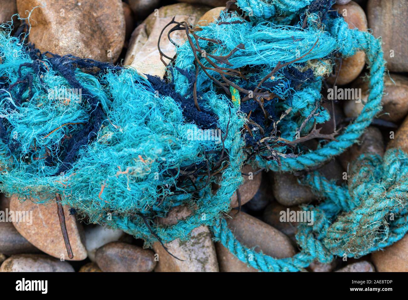 Tangled fishing nets and ropes on the beach Stock Photo - Alamy