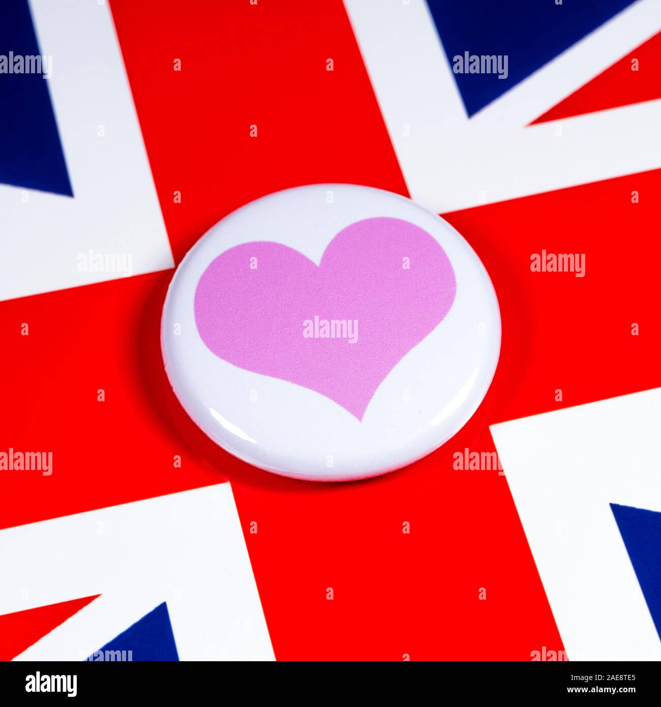 A pink heart symbol pictured over the flag of the United Kingdom Stock ...