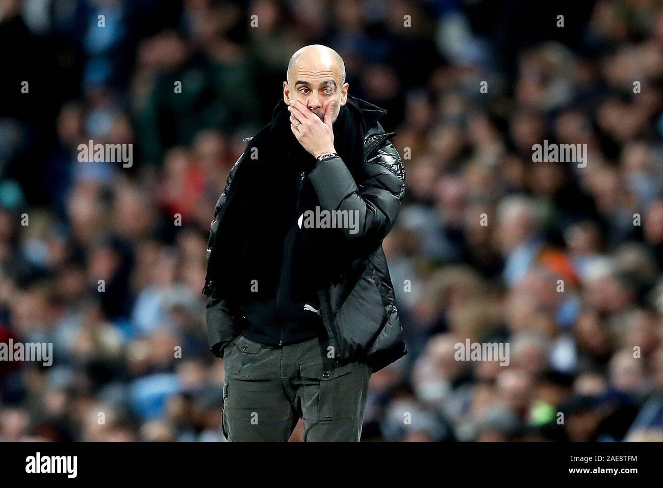 Manchester City manager Pep Guardiola appears dejected on the touchline ...