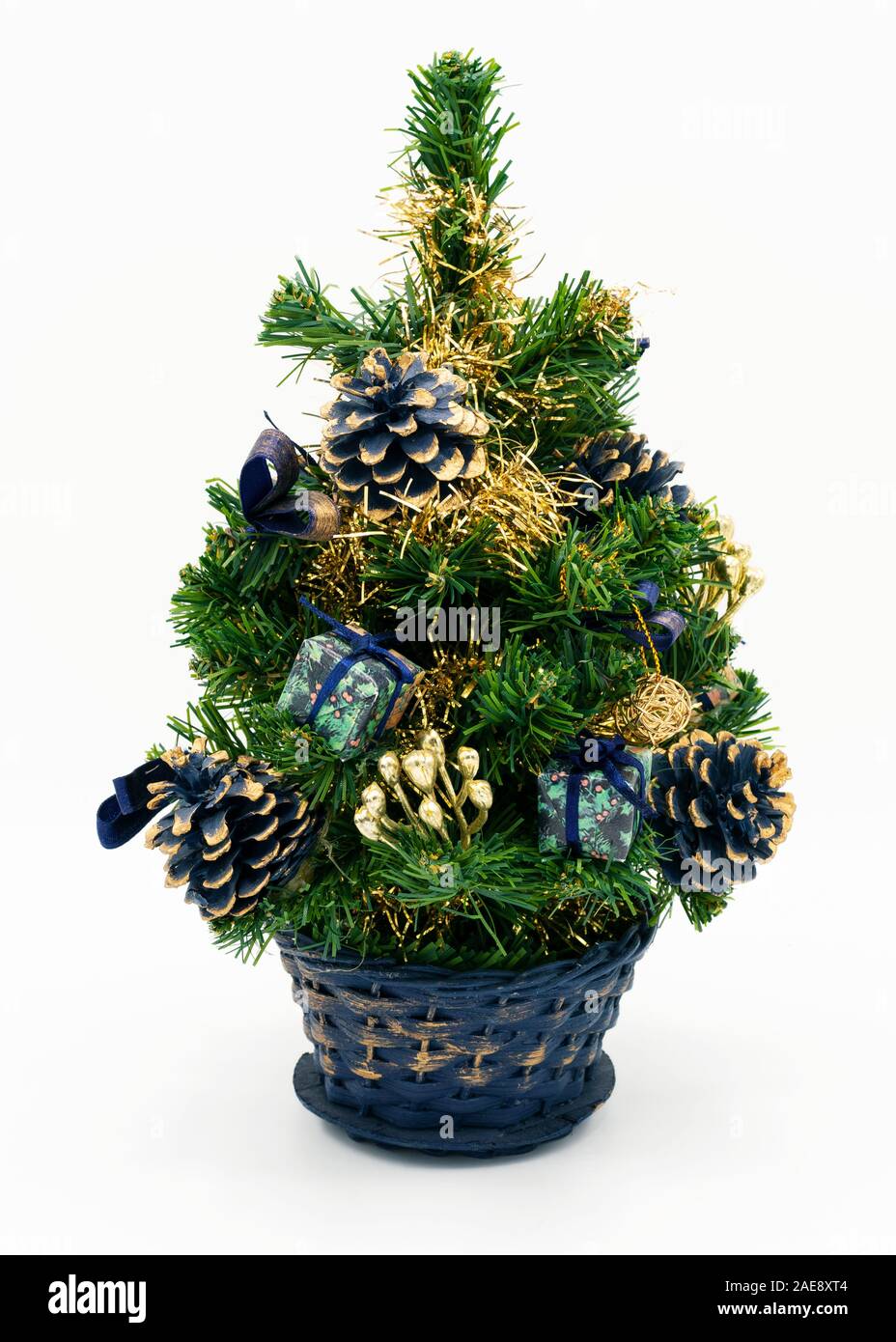 Small Christmas tree isolated on a white background Stock Photo - Alamy