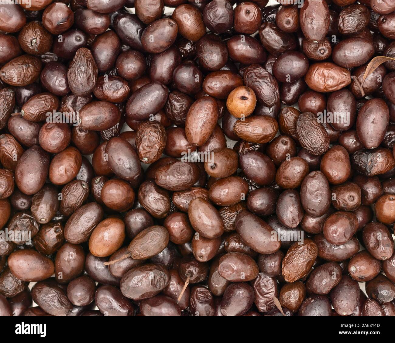 Fresh black olives as background. Food textures Stock Photo - Alamy