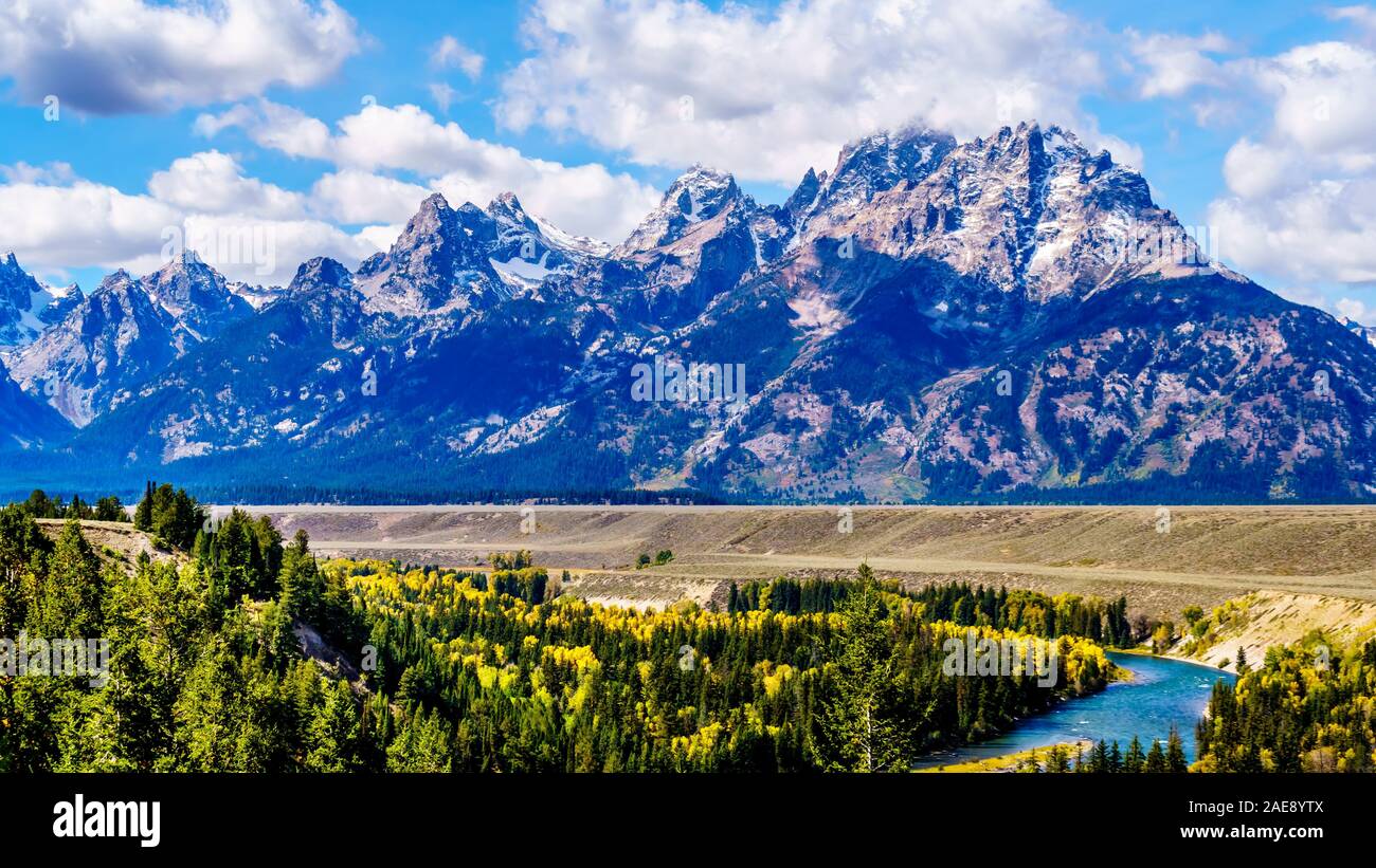 The peaks of The Grand Tetons behind the winding Snake River viewed ...