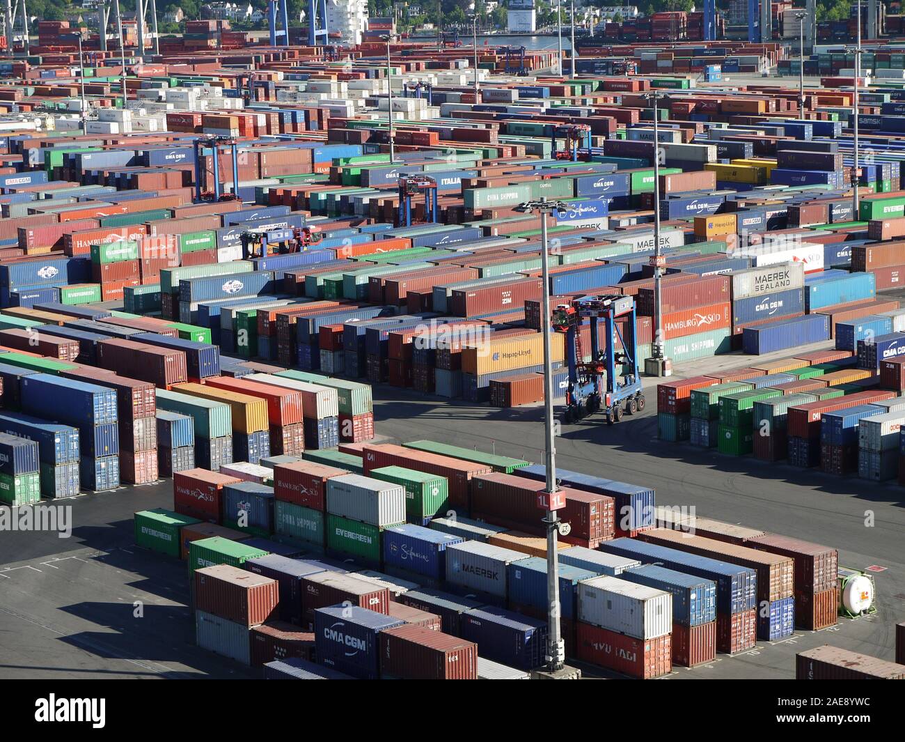 Containers stored on the wharf at the port of Hamburg before loading on ...
