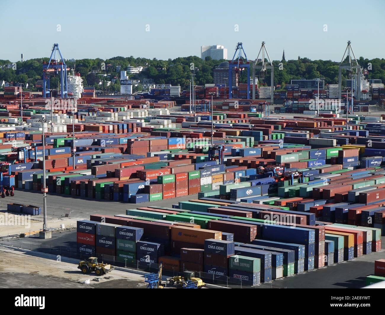 Containers stored on the wharf at the port of Hamburg before loading on ...