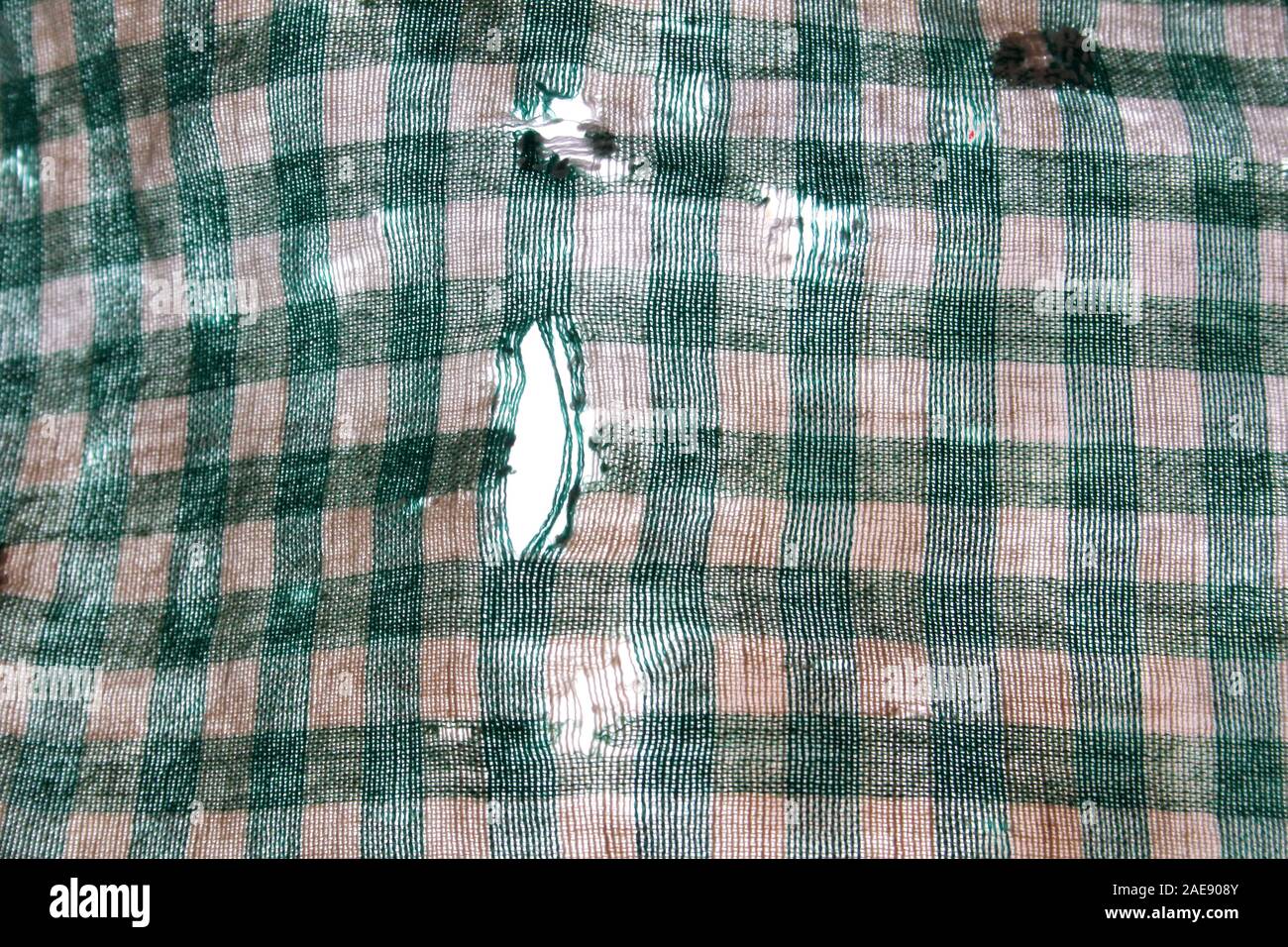 Torn cloth threads hi-res stock photography and images - Alamy