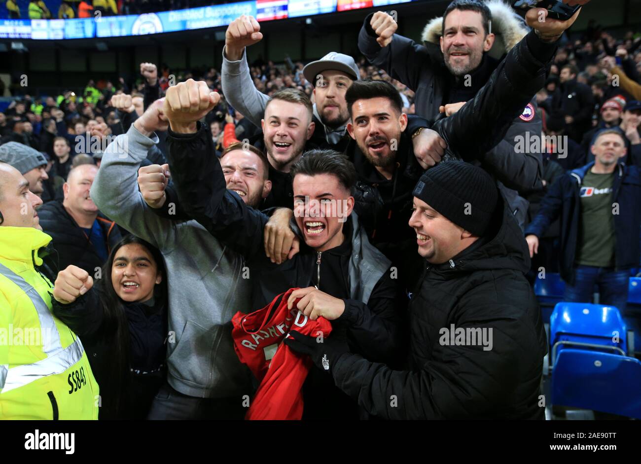 Manchester United fans celebrate with Marcus Rashford's shirt during ...