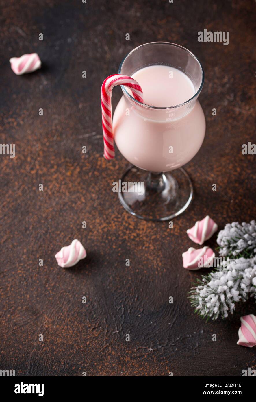 Pink Christmas cocktail with marshmallow Stock Photo - Alamy