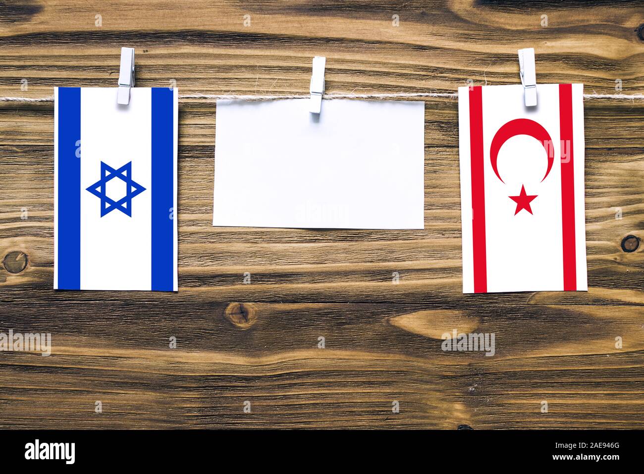 Hanging flags of Israel and Northern Cyprus attached to rope with ...