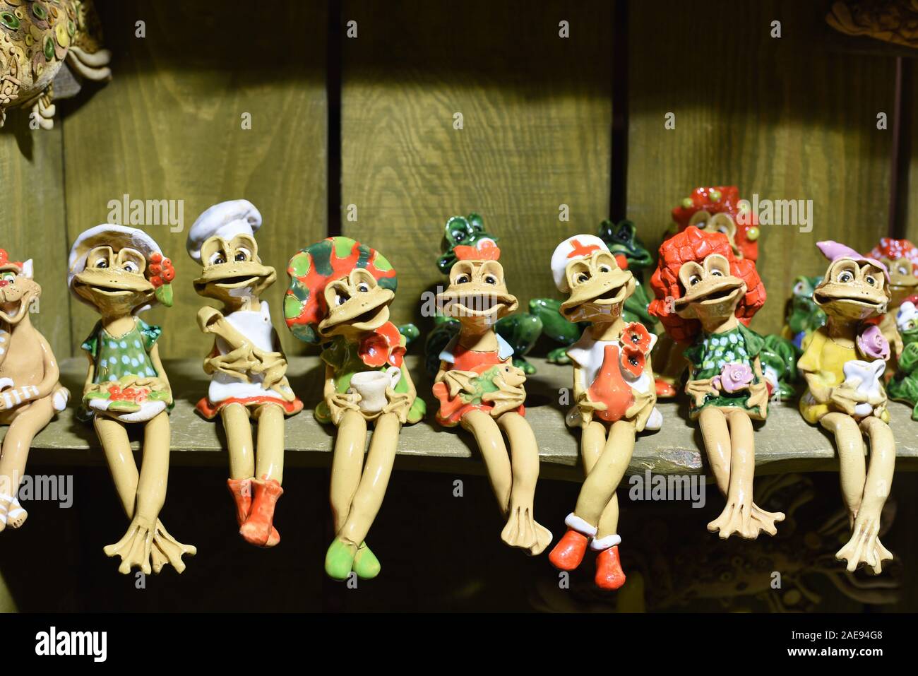 shelf sitter decor figurines- a group of colorful ceramic funny smiling ...