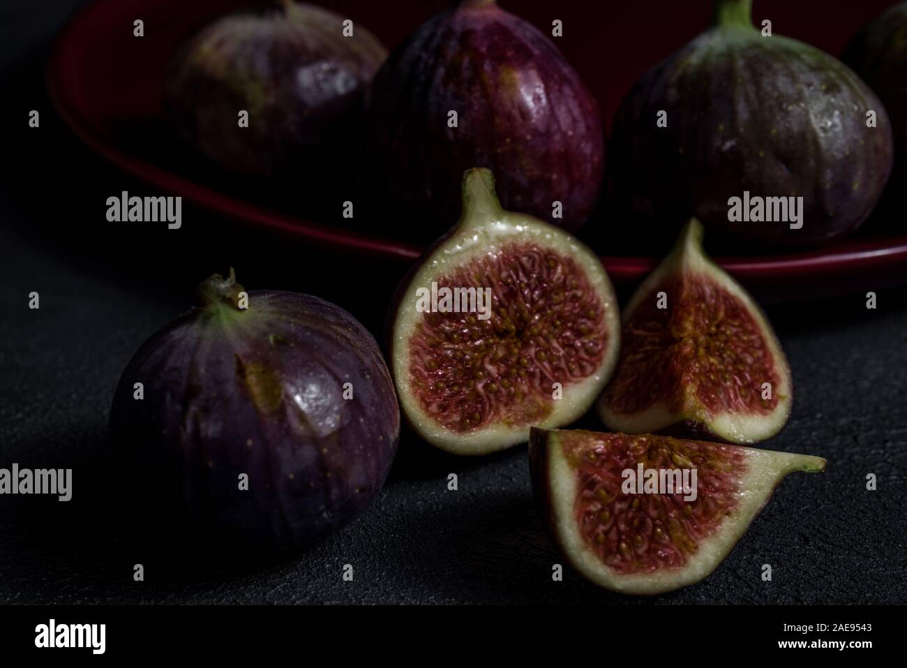 fresh figs close-up on black background. dark moody photo Stock Photo ...