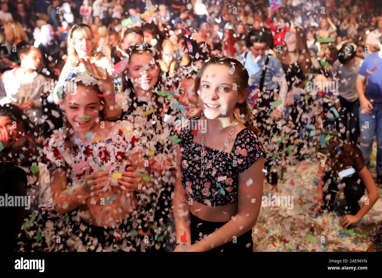 Fans in the crowd play with ticker tape during day one of Capital's ...