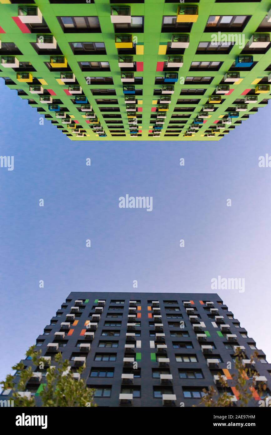 Tall house. Facades of apartment buildings going up. Parallel houses ...