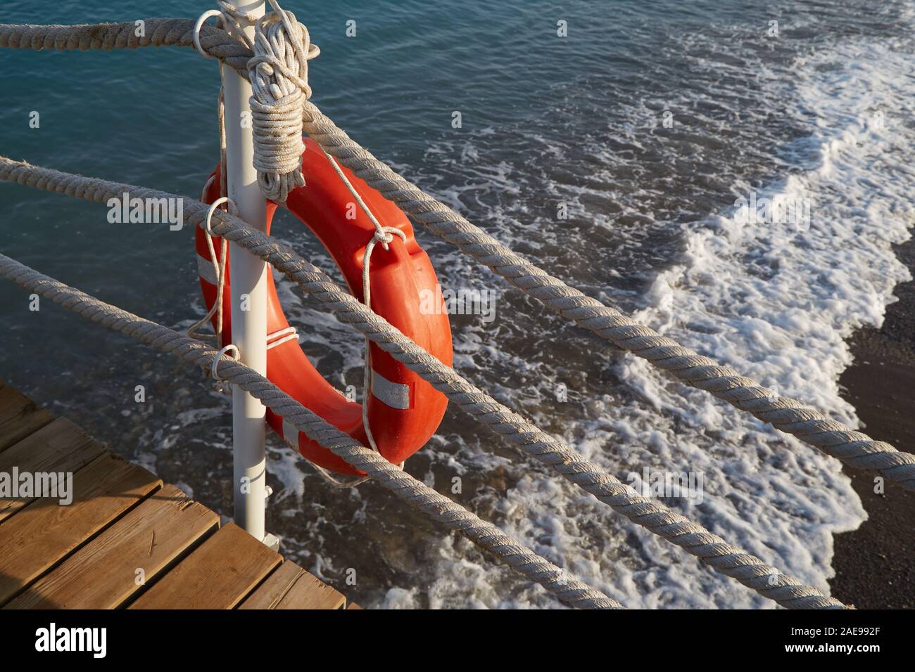 Lifebuoy drowning man in sea hi-res stock photography and images - Alamy