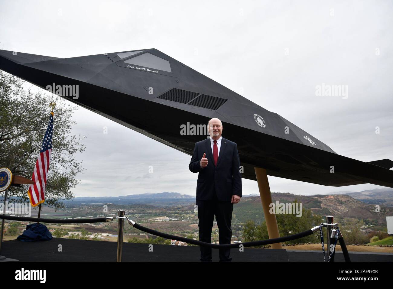 Scott Stimpert, a former pilot of the F-117 poses with his F-117 ...