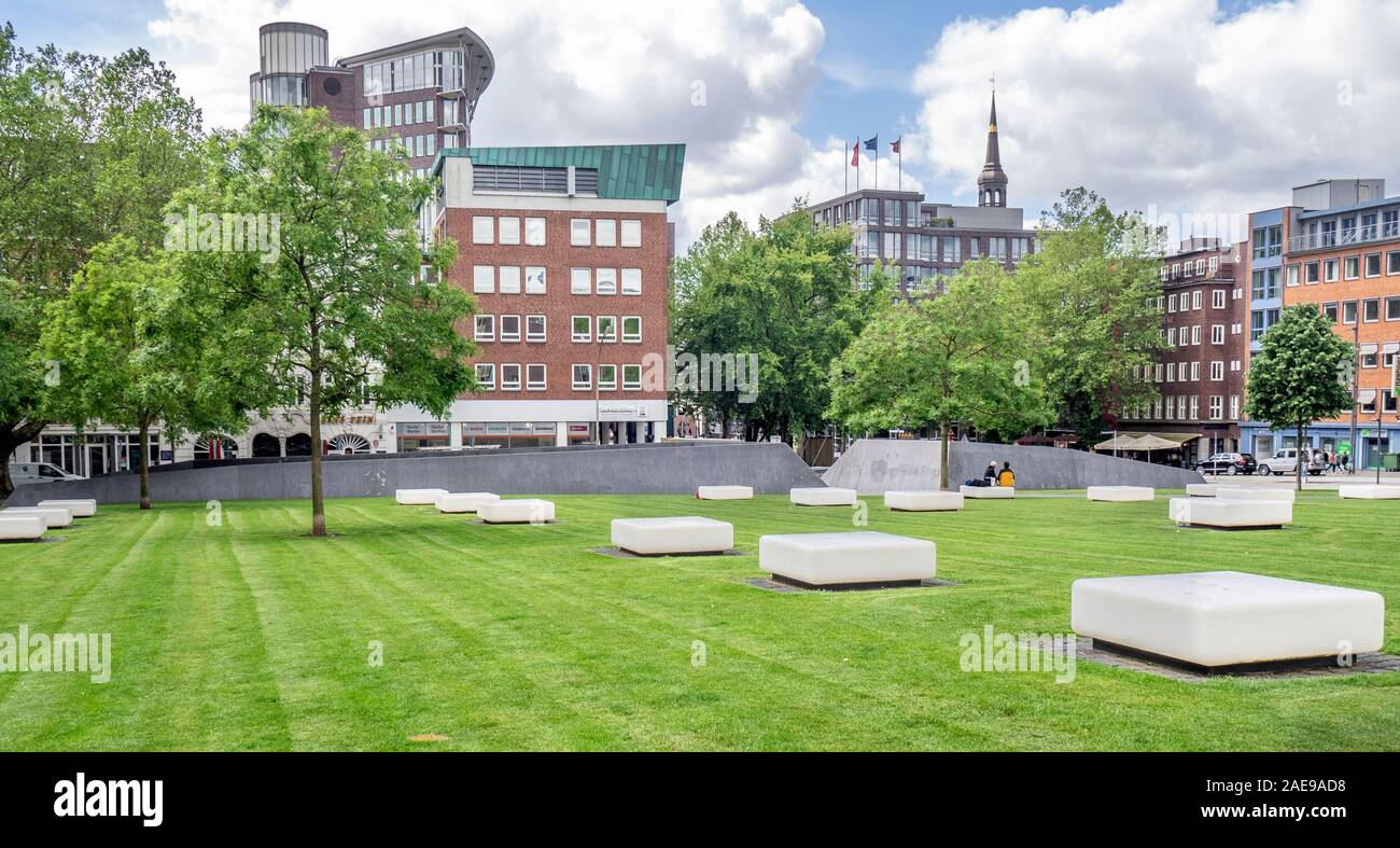 White benches in Domplatz garden the original site of Hamburg Cathedral ...