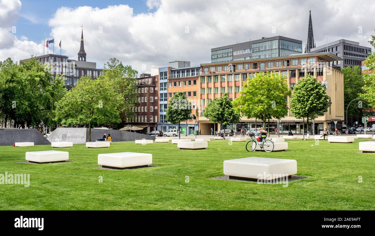 White benches in Domplatz garden the original site of Hamburg Cathedral ...