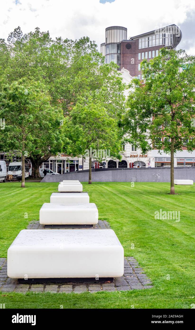 White benches in Domplatz garden the original site of Hamburg Cathedral ...