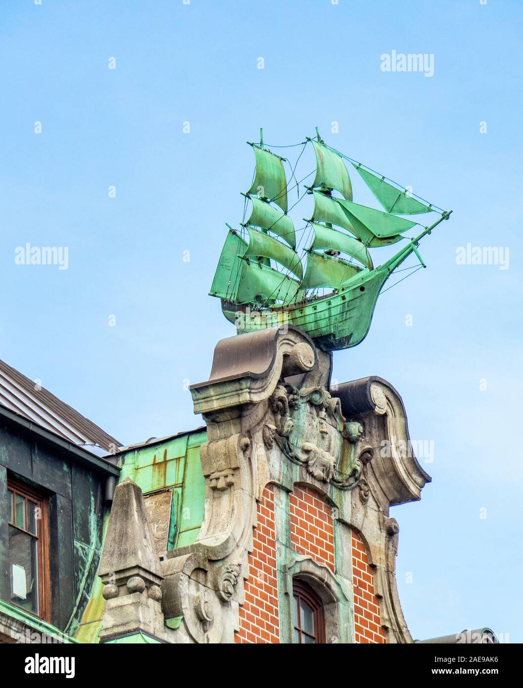 Sculpture of sailing ship on the top of gable of Globushof a red brick ...