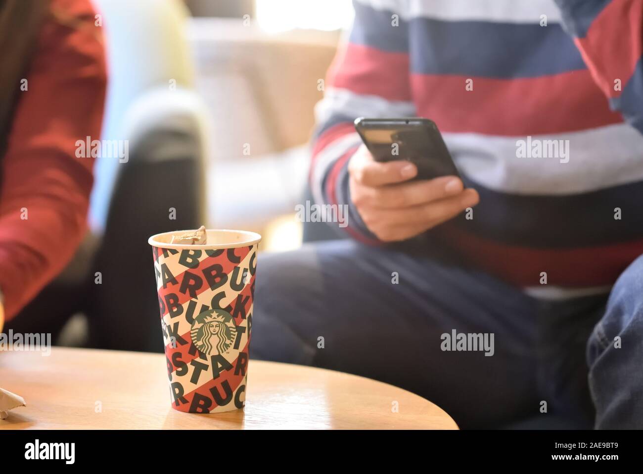 PENANG, MALAYSIA - AUG 07, 2019: Female hand holding a Starbucks coffee ...