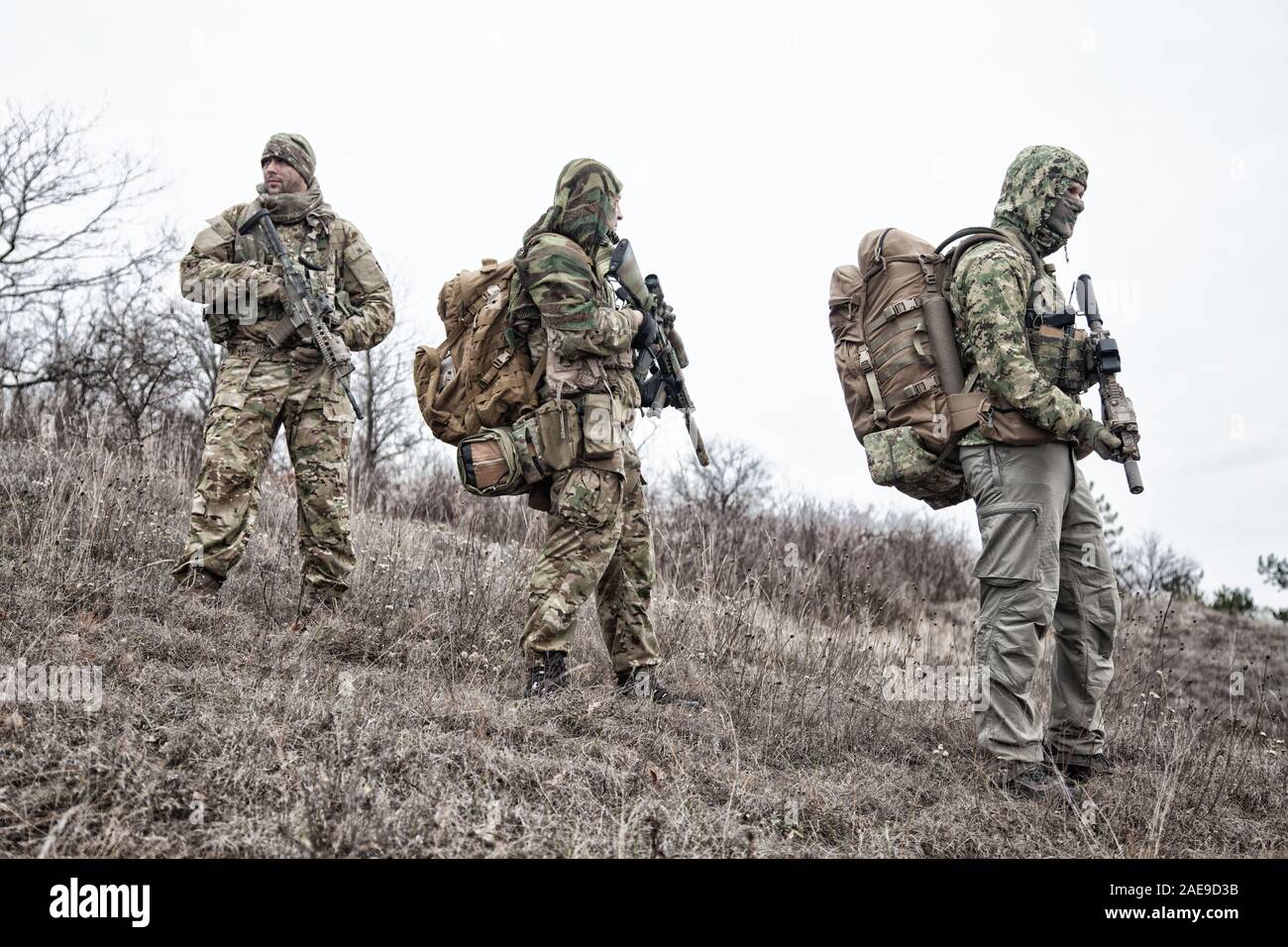 Military army soldiers team members patrolling area Stock Photo - Alamy