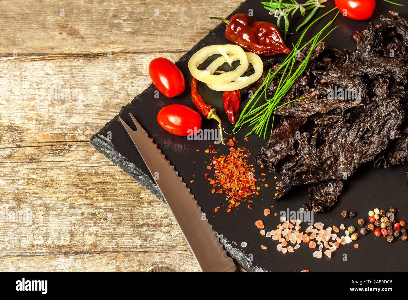 Dried meat on kitchen table. Domestic production of dried beef. Meat ...