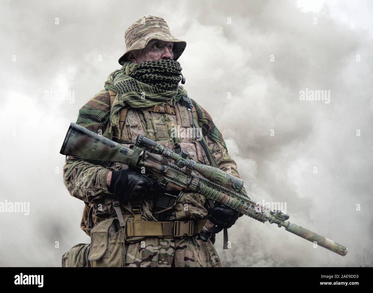 Brutal commando army soldier veteran armed sniper rifle Stock Photo - Alamy