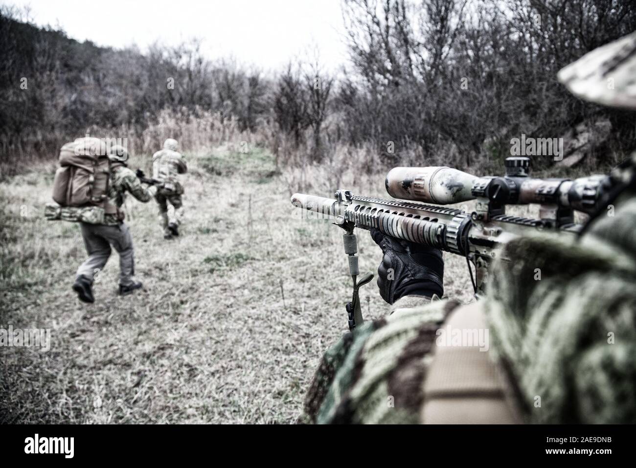 Commando army soldiers fighters squad rushing in woodland Stock Photo ...