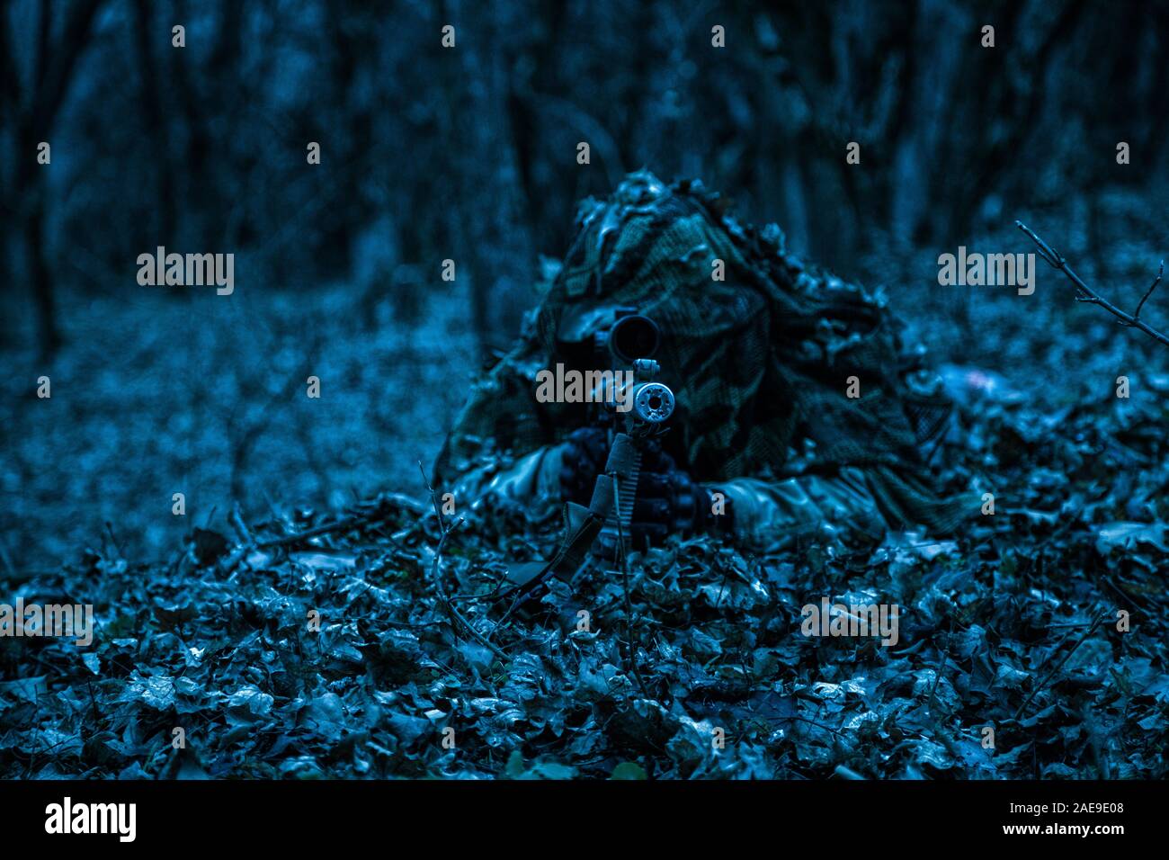 Army military sniper hiding on ground in forest leaves Stock Photo - Alamy