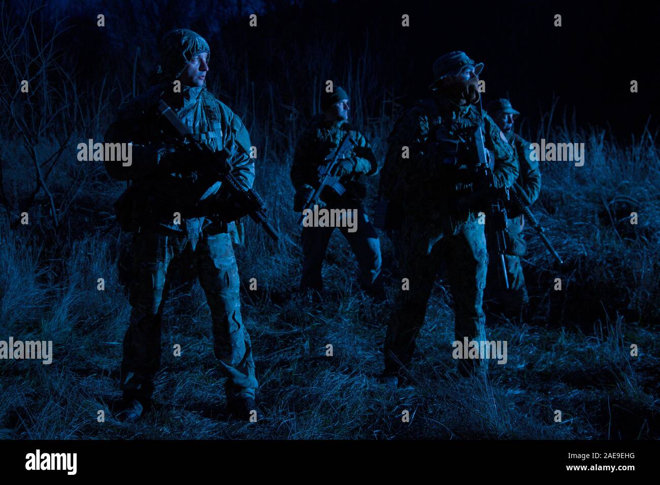 Army soldiers crew patrolling territory at night Stock Photo - Alamy
