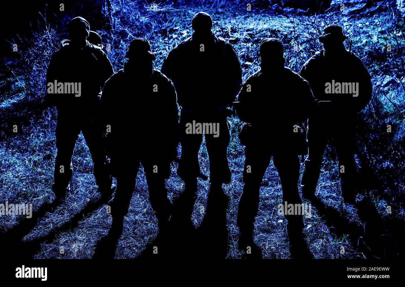 Commandos soldiers group going on night patrol Stock Photo - Alamy
