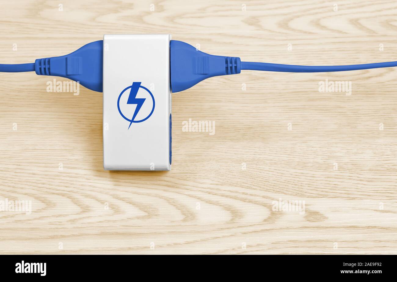 Two blue cables connected to a multiple socket over a light wood ...